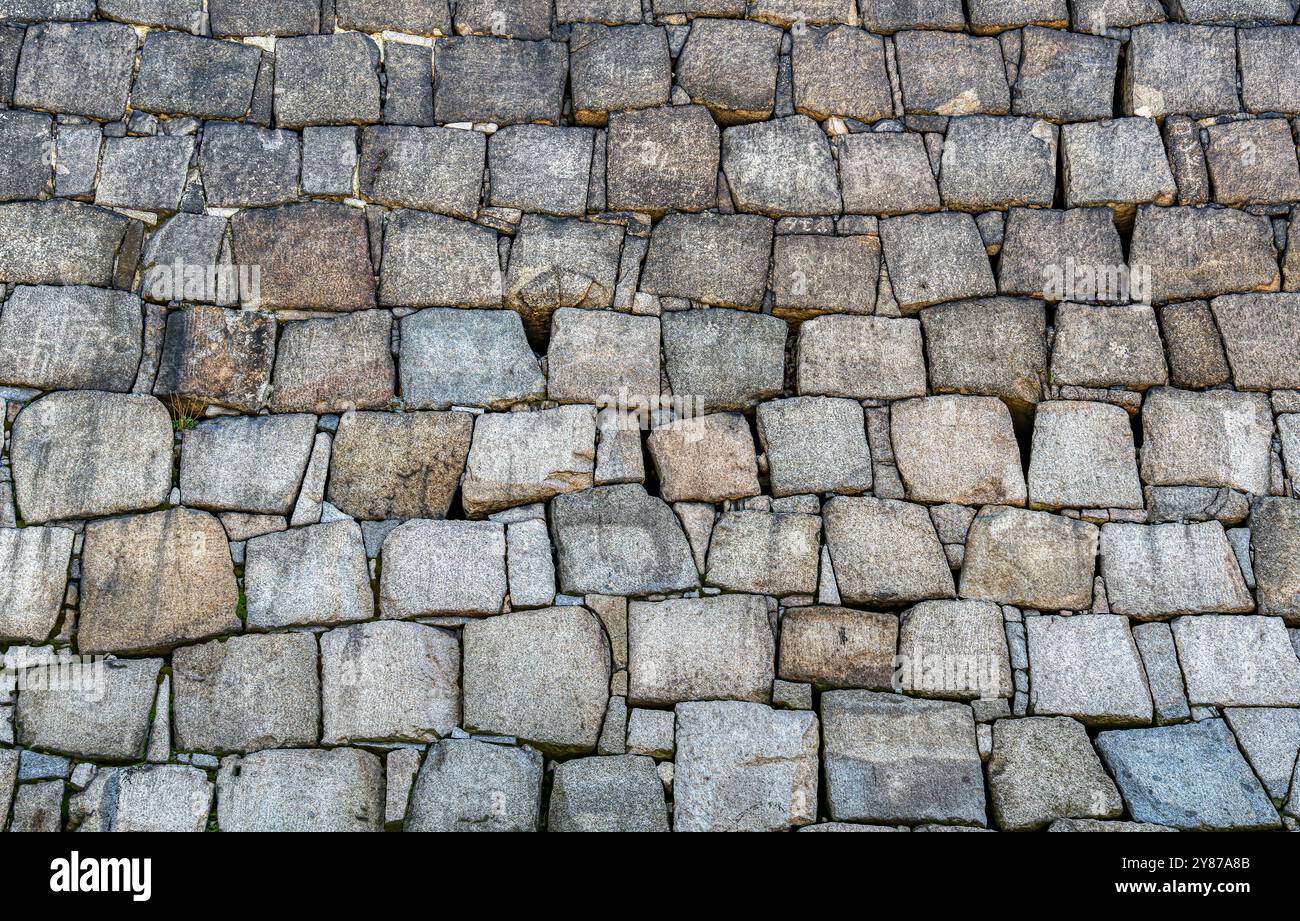 Traditional japanese stone wall moat at the base of Osaka Castle. Texture background Stock Photo ...