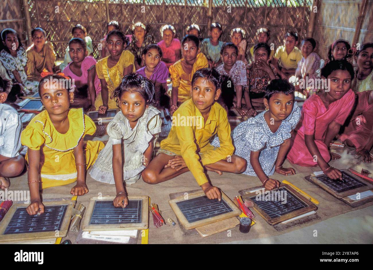 Bangladesh, Saturia, primary school class with chalk, slates. pencil ...