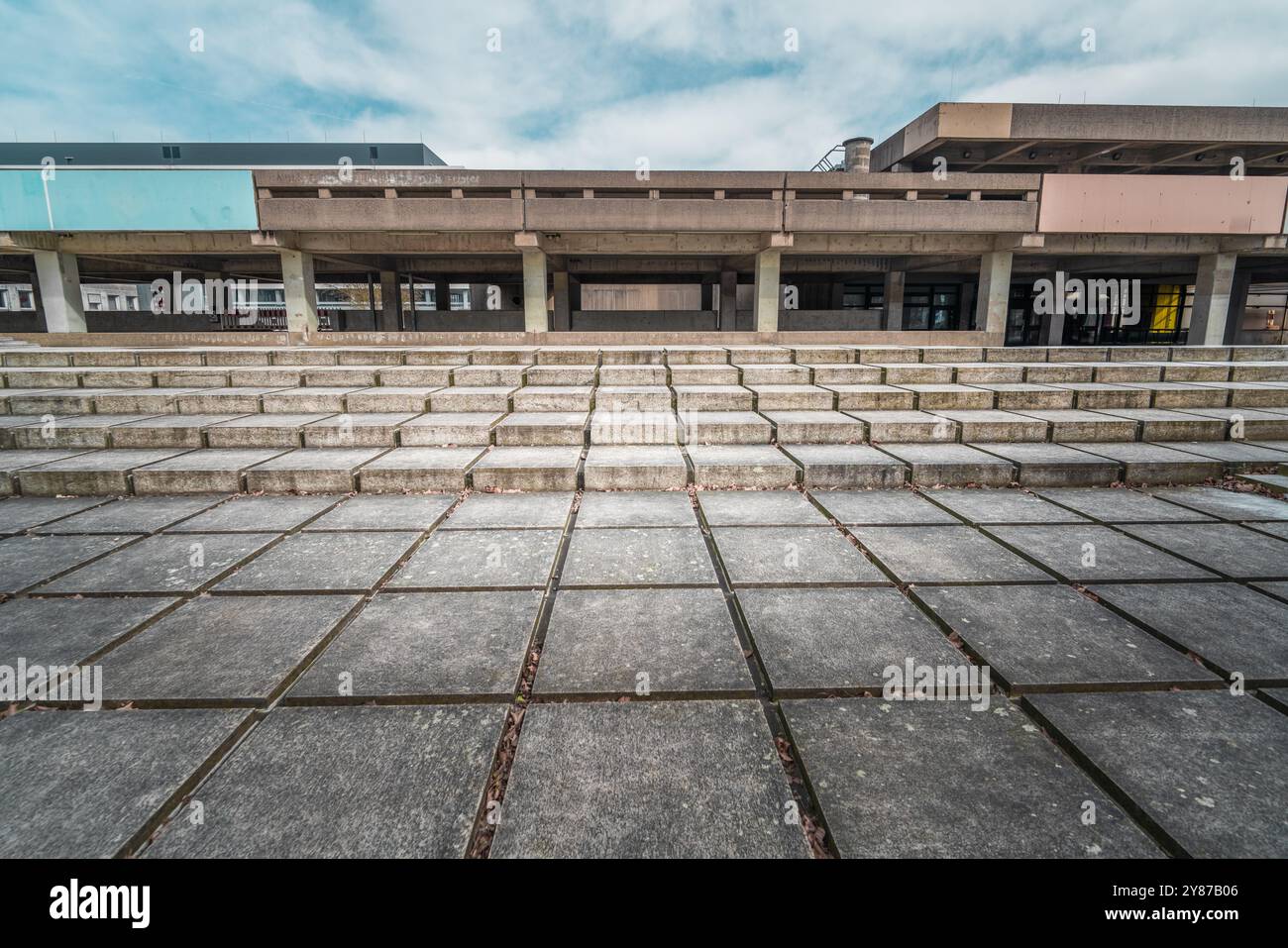 Empty concrete housing estate space. Grey exterior with stairs. Modern ...