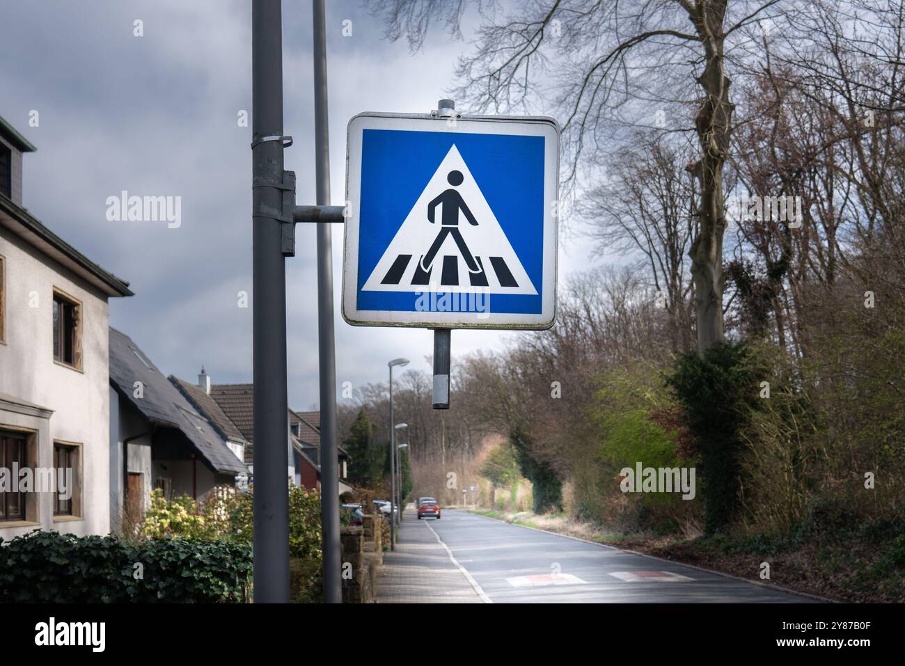 Road sign, pedestrian crossing. Street in a housing estate. German ...