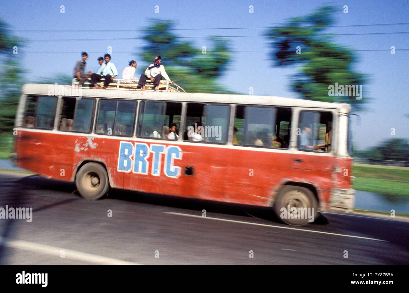 Bangladesh, a full long-distance bus with passengers on the roof Stock ...