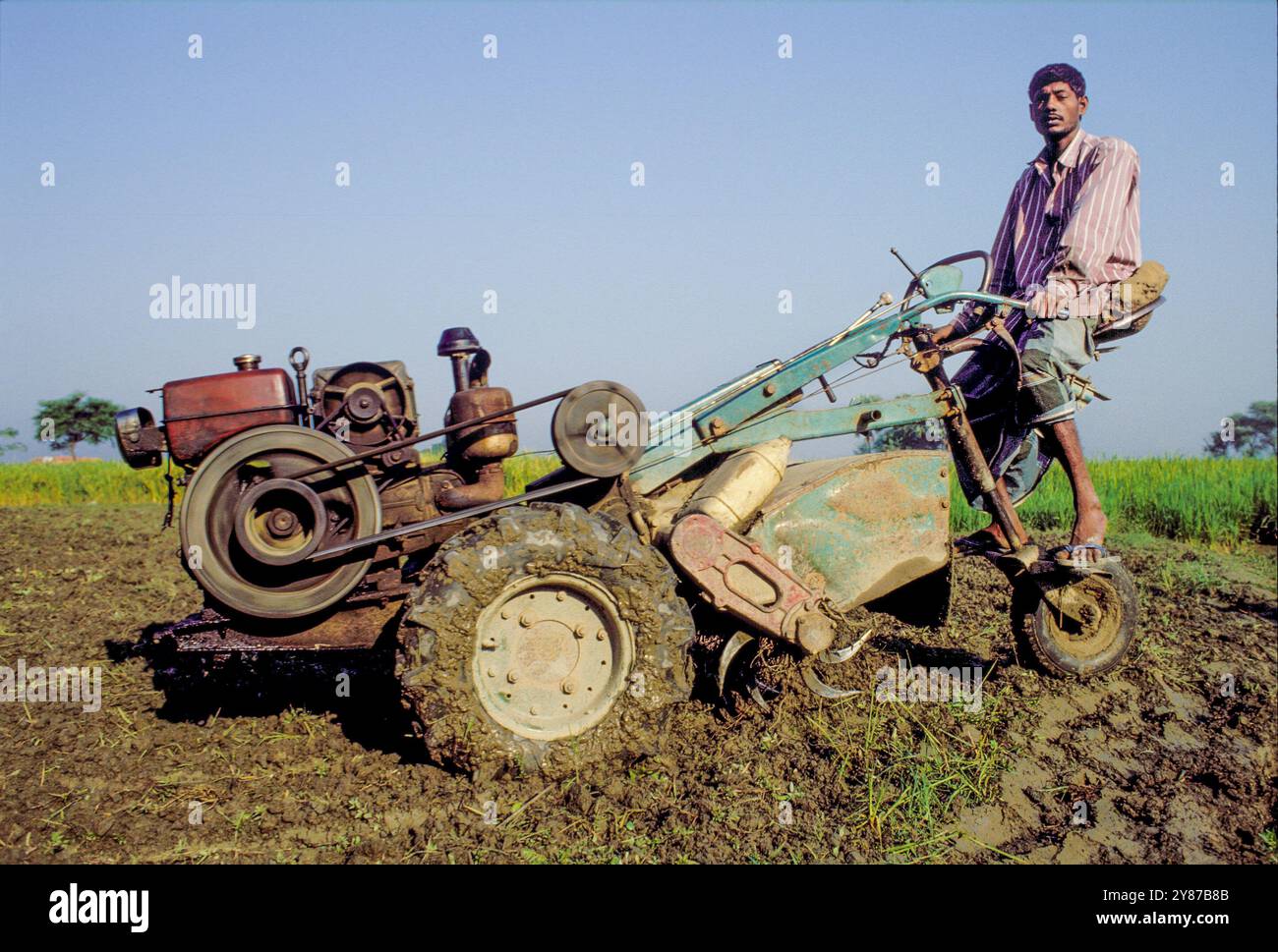 Bangladesh; farmer ploughing the soil with a motorised plough Stock ...