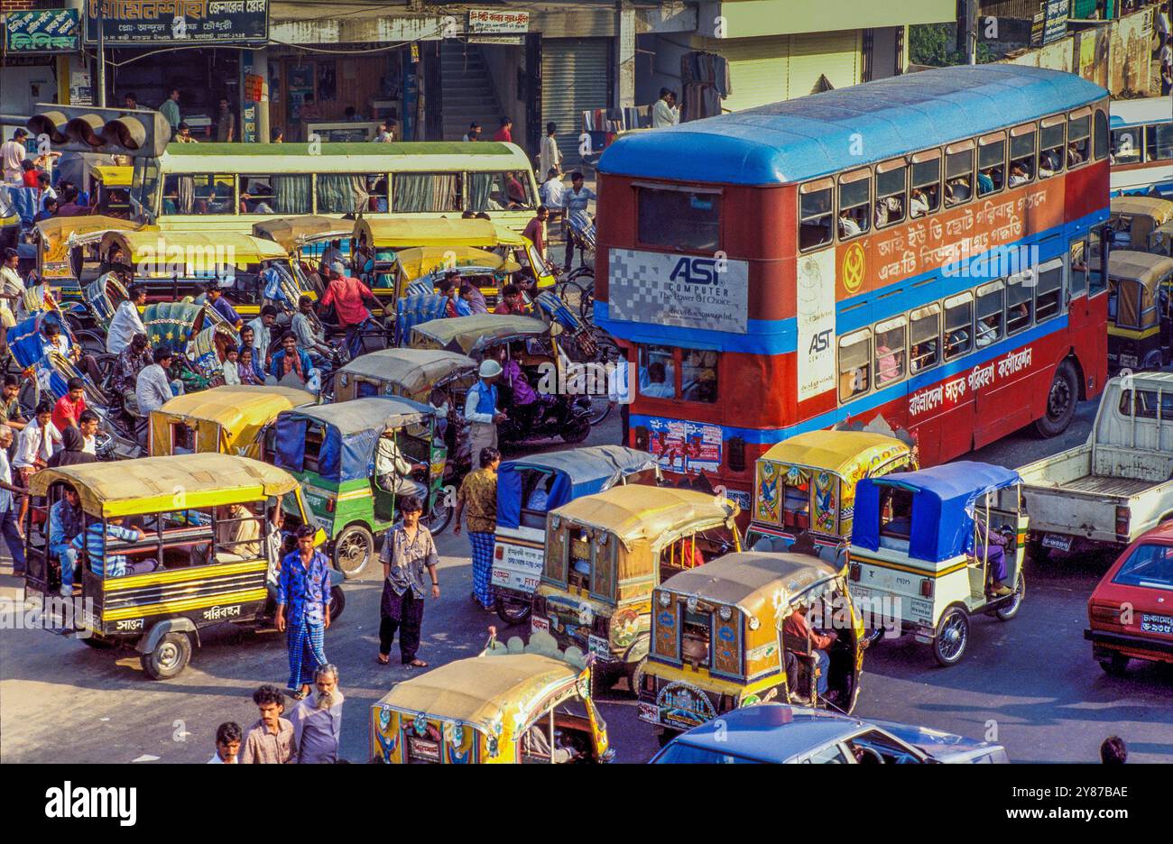 Bangladesh, Dhaka, crowded street with many auto rickshaws and a double ...