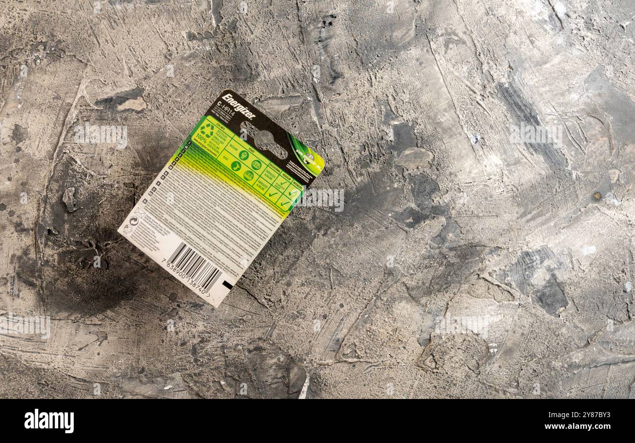 On a grey textured surface a pair of unused rechargeable C cell ...