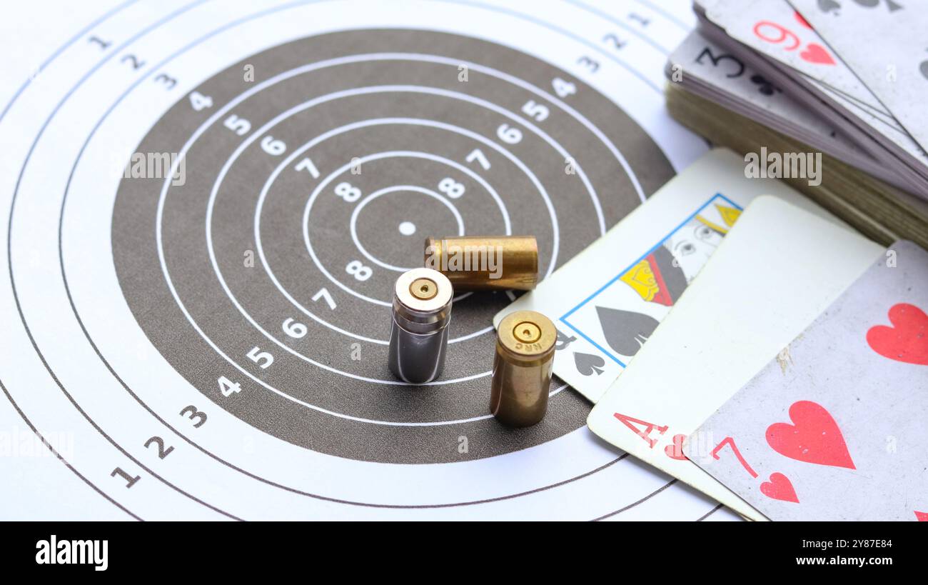 Empty bullet casings on a shooting target background, with playing ...