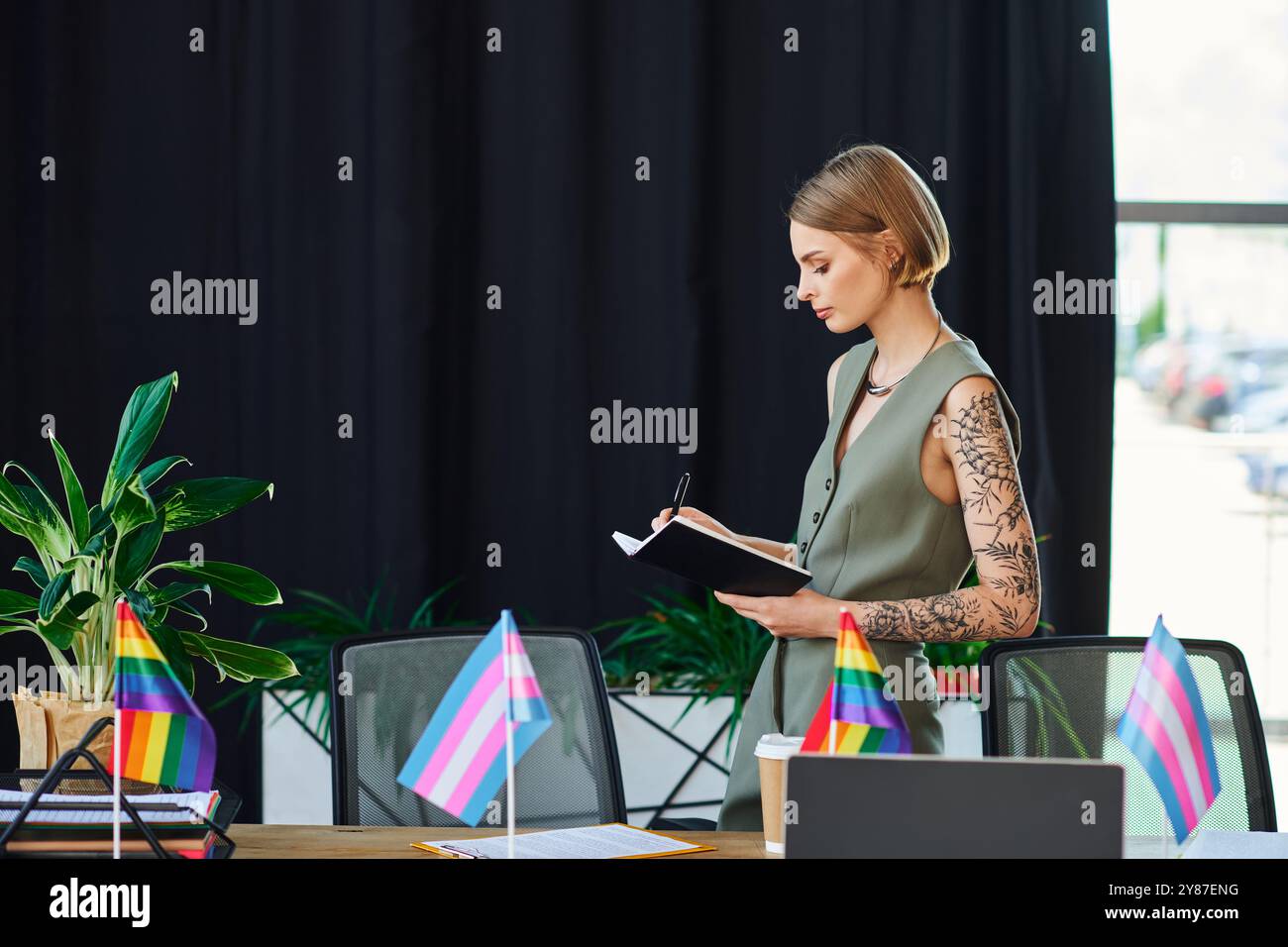 A dedicated team member engages in creative work while surrounded by ...