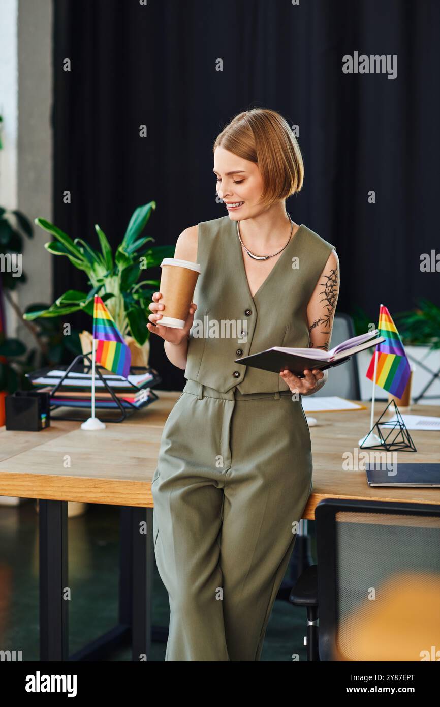 A woman enjoys coffee while reviewing notes in an inclusive office ...