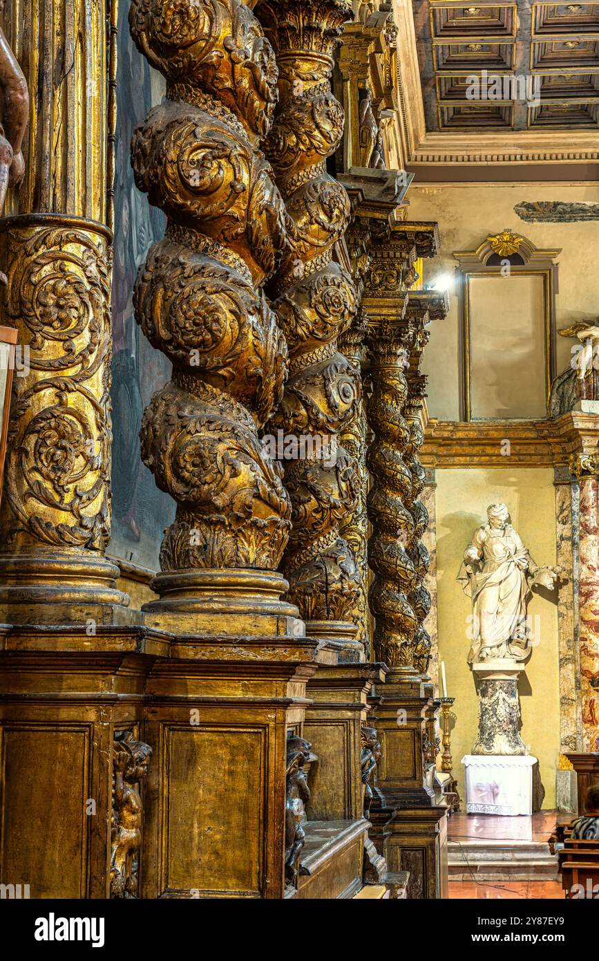 Detail of the twisted columns in gilded wood of one of the altars of ...