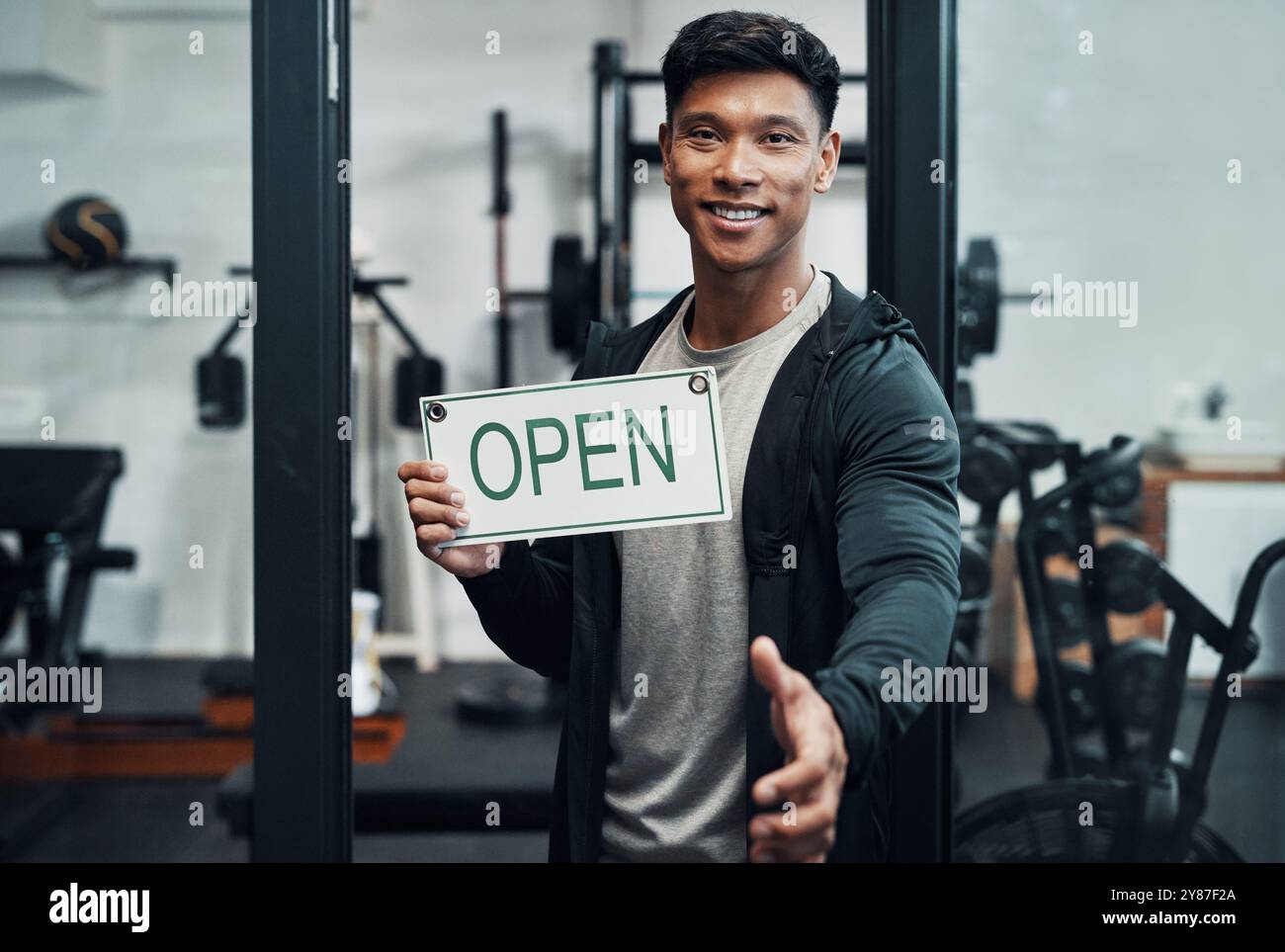 Man, portrait and open sign at gym for fitness with smile, training or ...