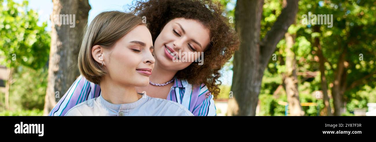 Two friends are connecting joyfully, relishing their time outdoors in a ...
