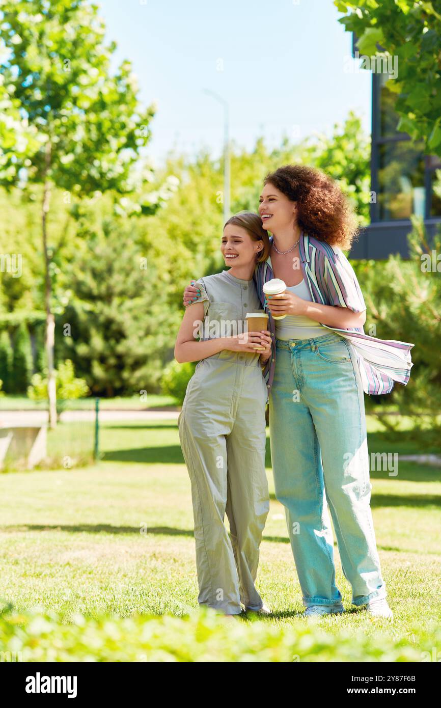 Two friends share a joyful moment outdoors, embracing friendship amid ...