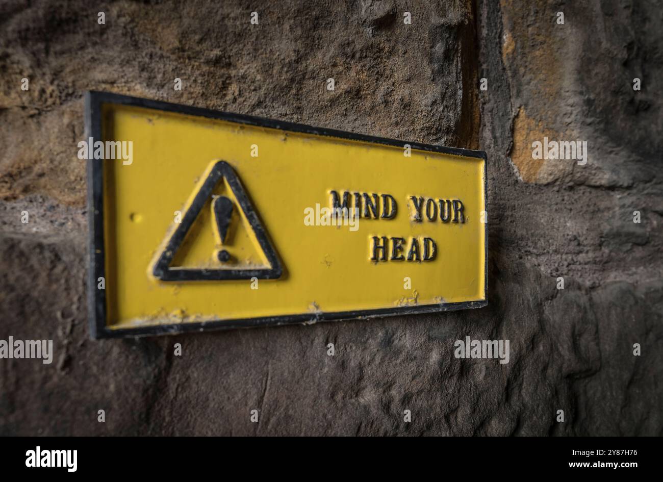 hazard warning sign on a historic wall Stock Photo - Alamy