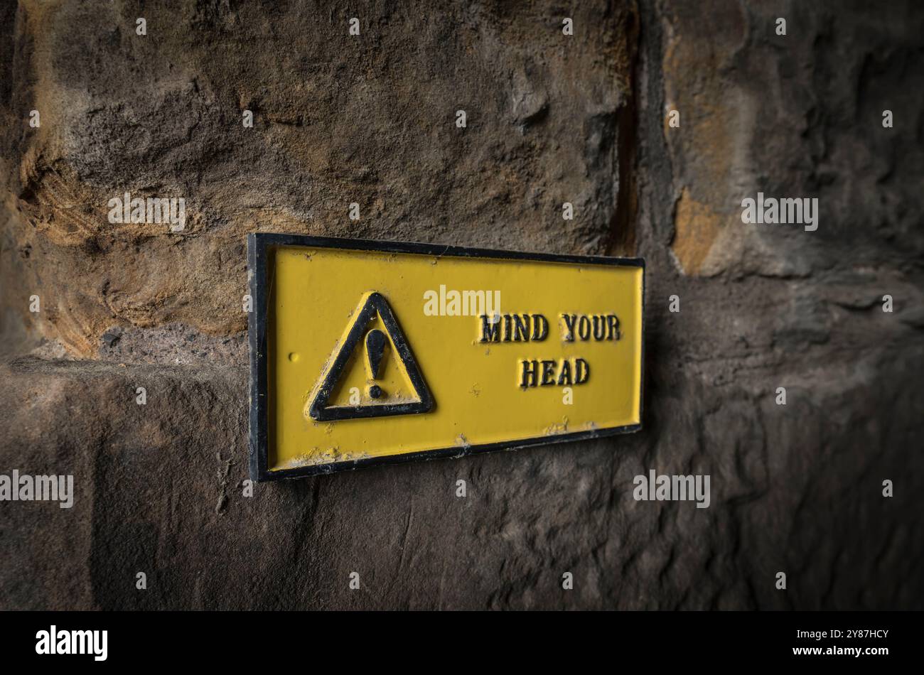 hazard warning sign on a historic wall Stock Photo - Alamy