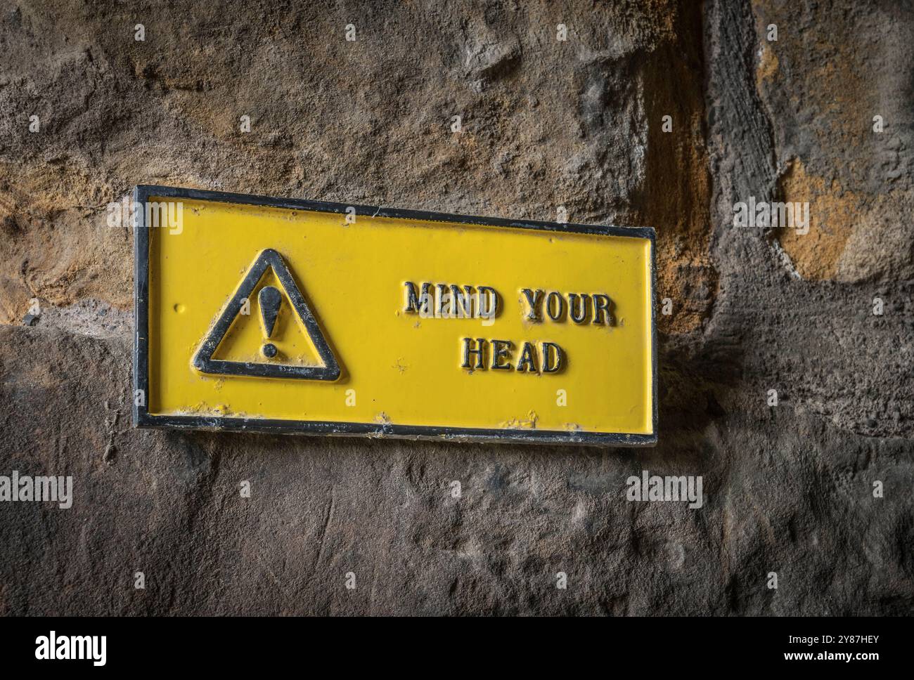 hazard warning sign on a historic wall Stock Photo - Alamy