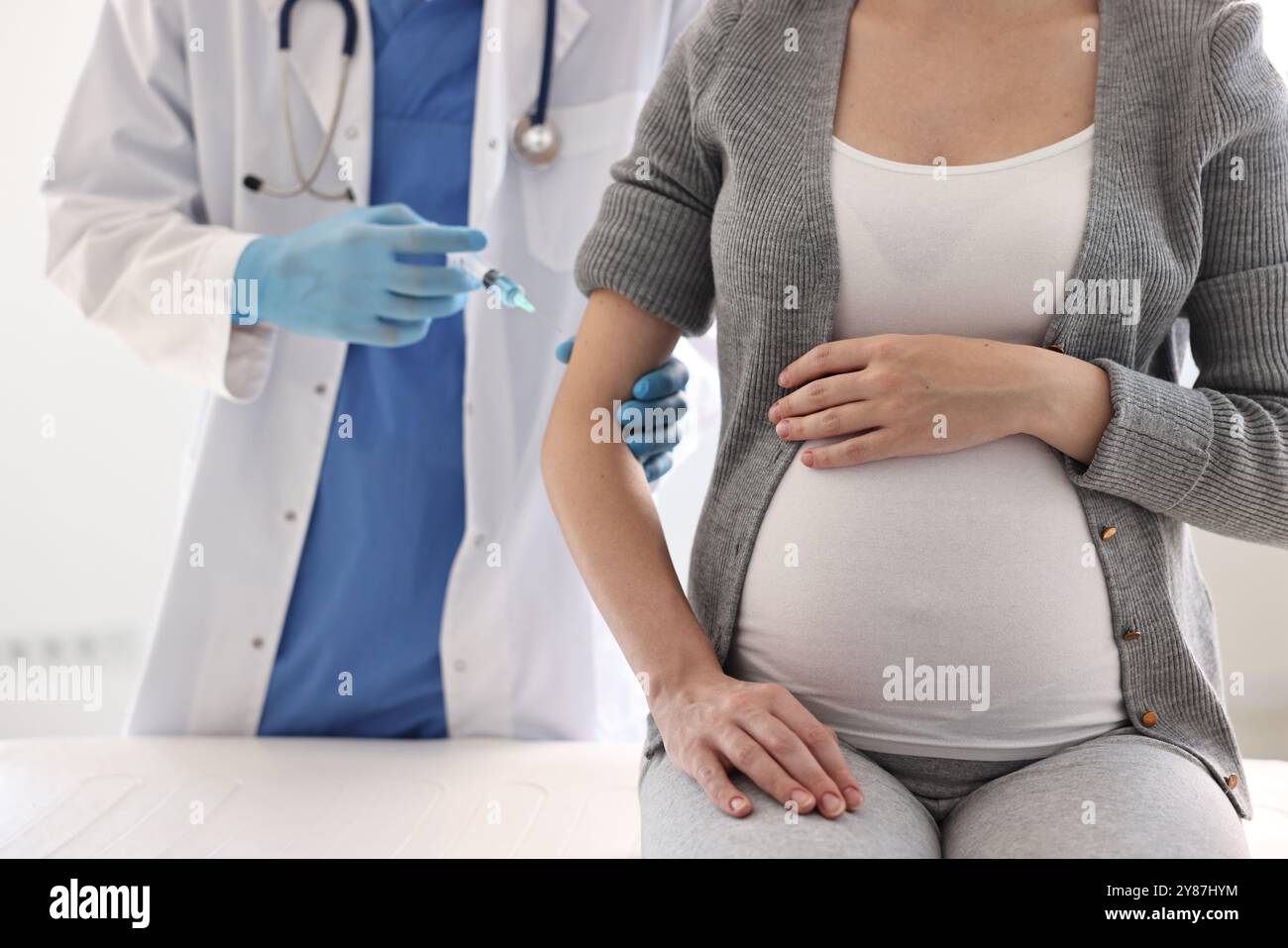 Doctor giving injection to pregnant woman at hospital, closeup Stock ...