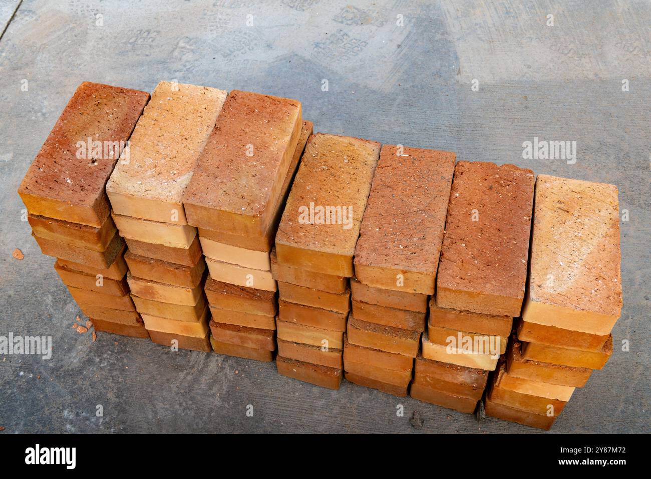 pile of bricks on construction site, modern construction uses bricks in ...