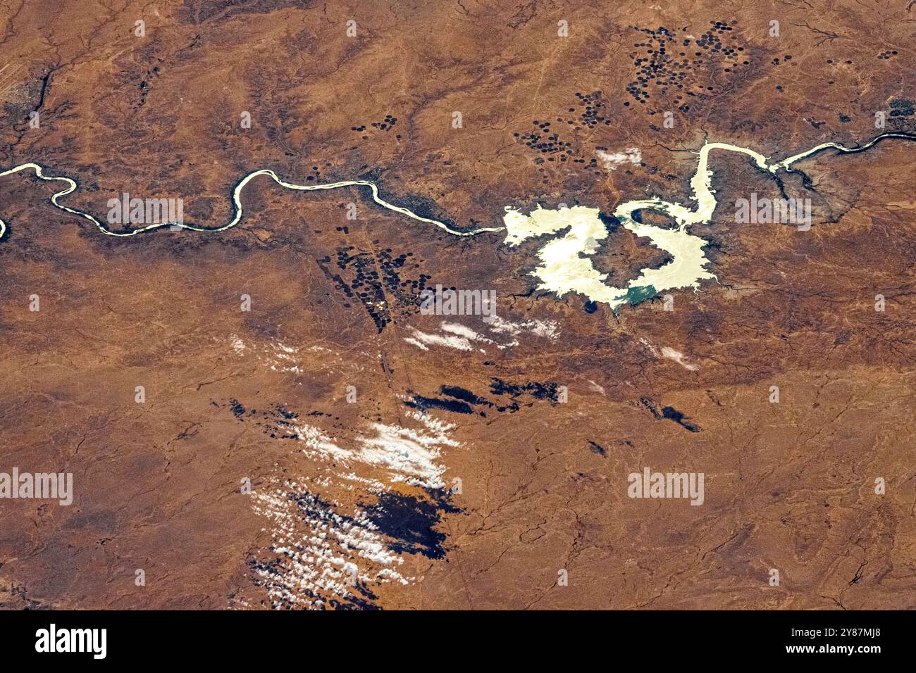 Sunlight reflection on river water, Iran. Digital enhancement of an ...