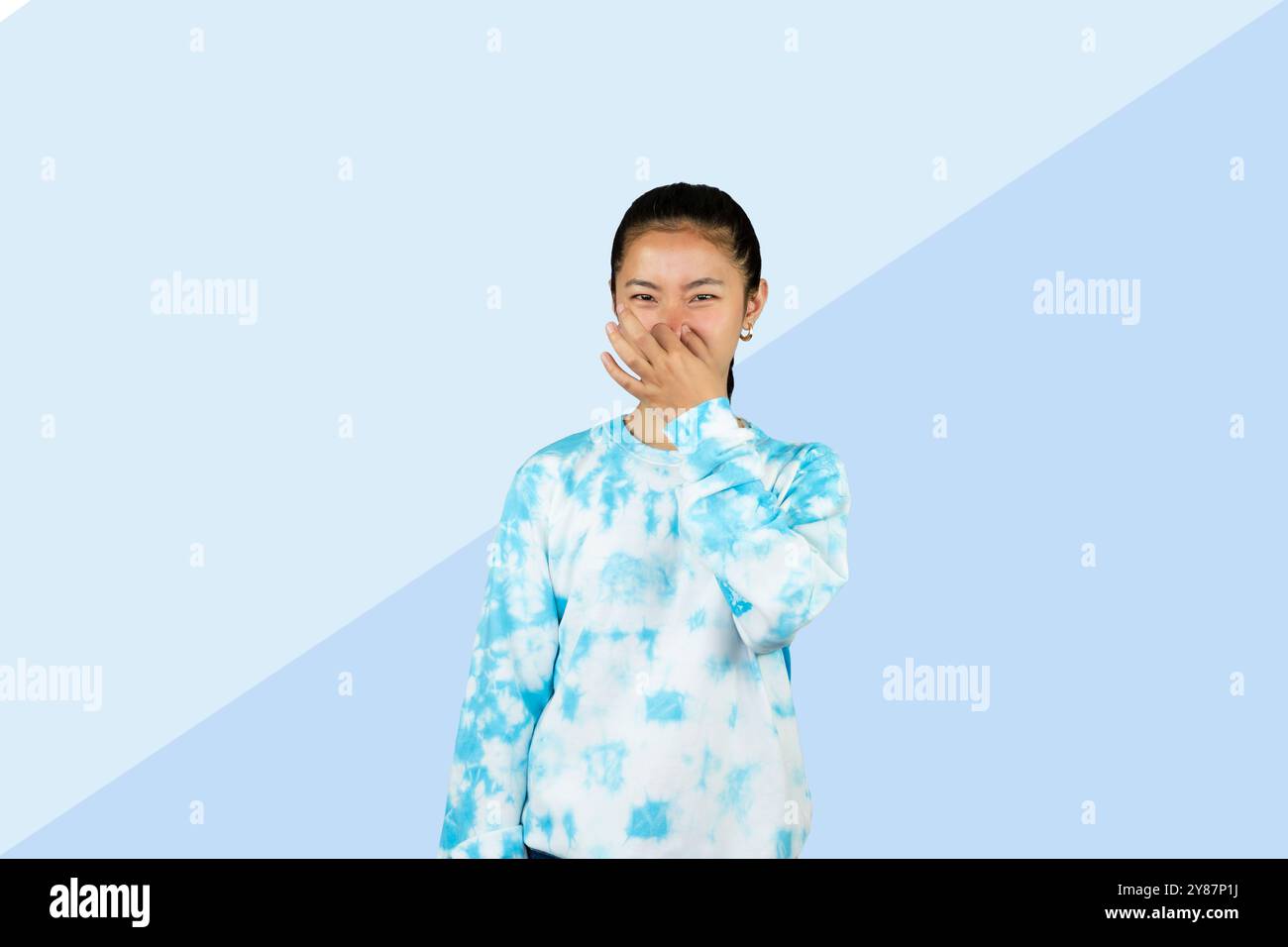 Young Asian Girl in blue dress disgust happy expression and face ...