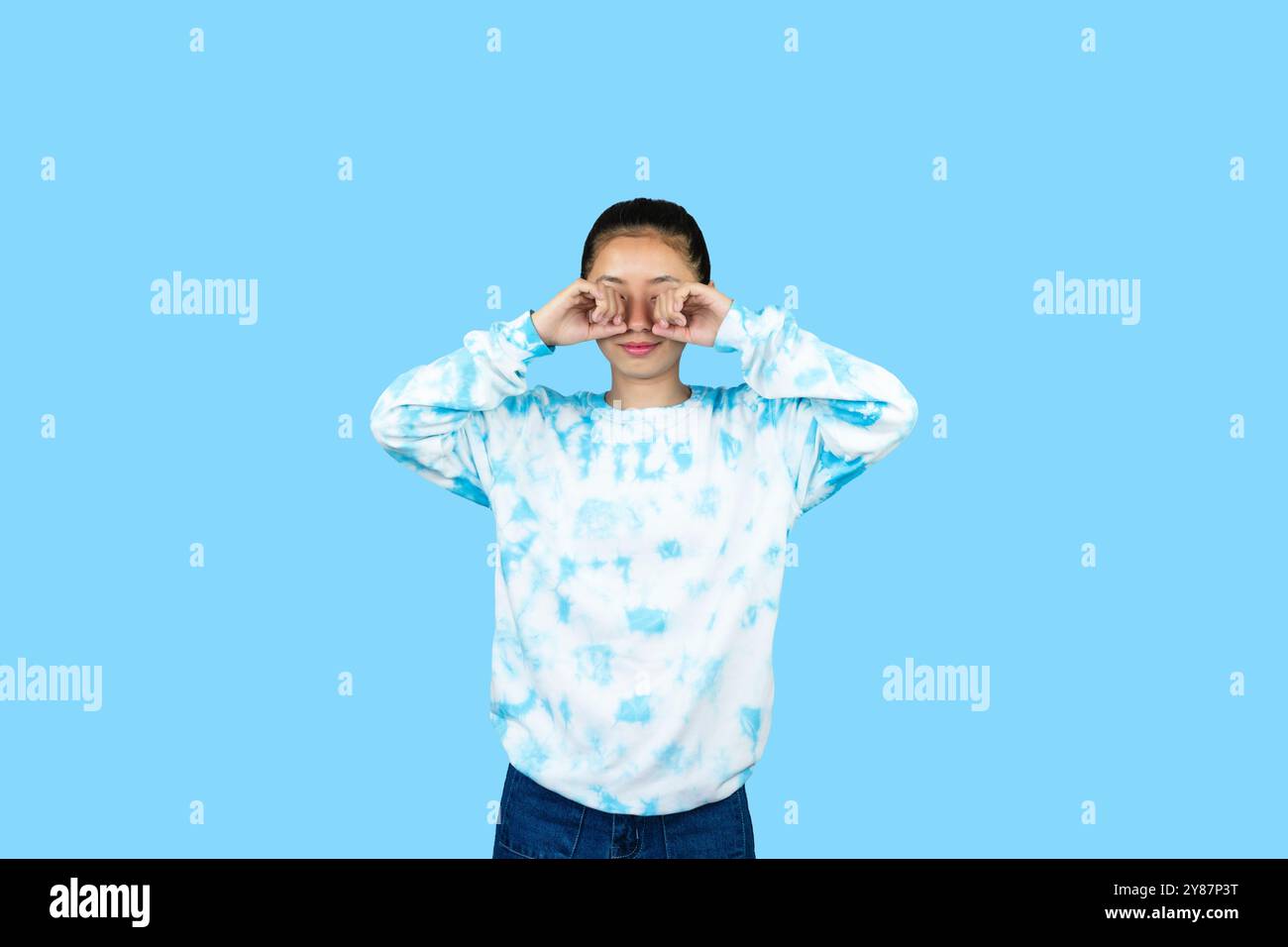 Young Asian Girl in blue dress disgust happy expression and face ...