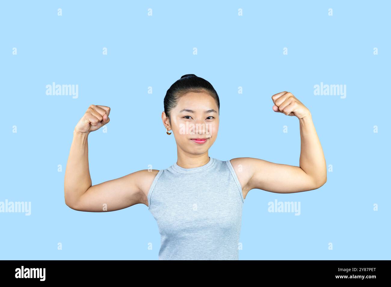 Strong Female Asian Doing Pose for Womens Day Bicep Flex Stock Photo ...