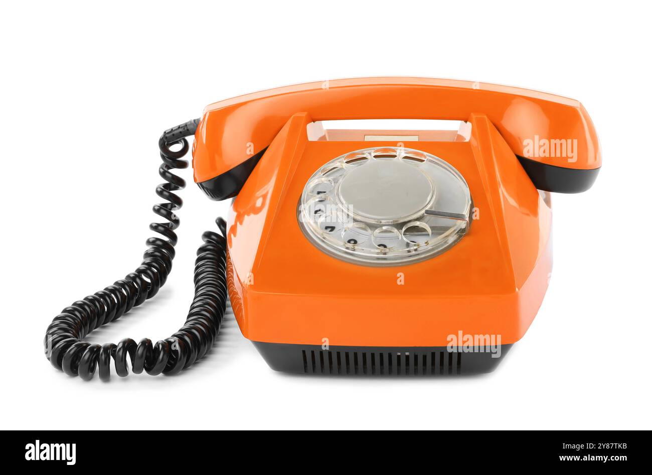 Old orange telephone with rotary dial isolated on white Stock Photo - Alamy