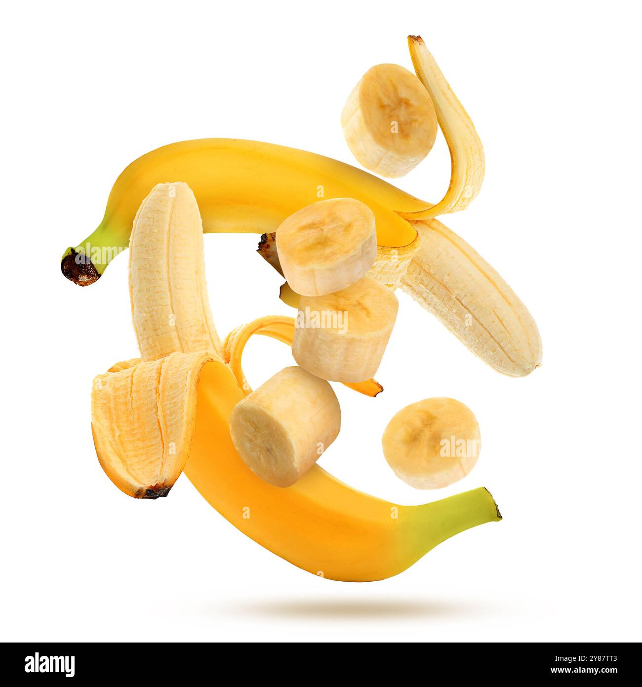 Fresh ripe bananas falling on white background Stock Photo - Alamy