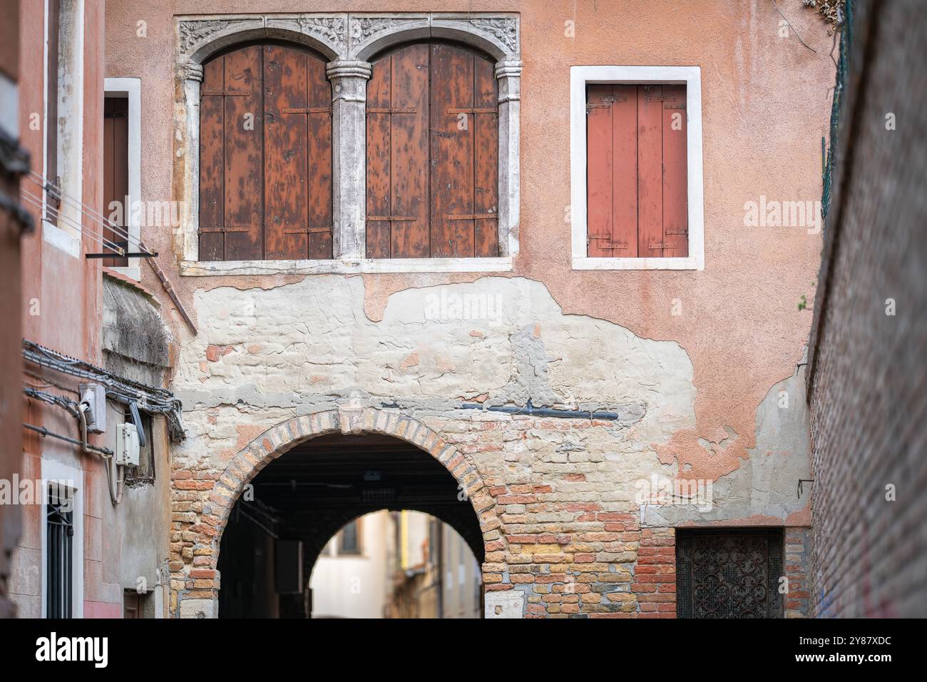 Street with archway in the historical italian town, Venice. Close-up of ...