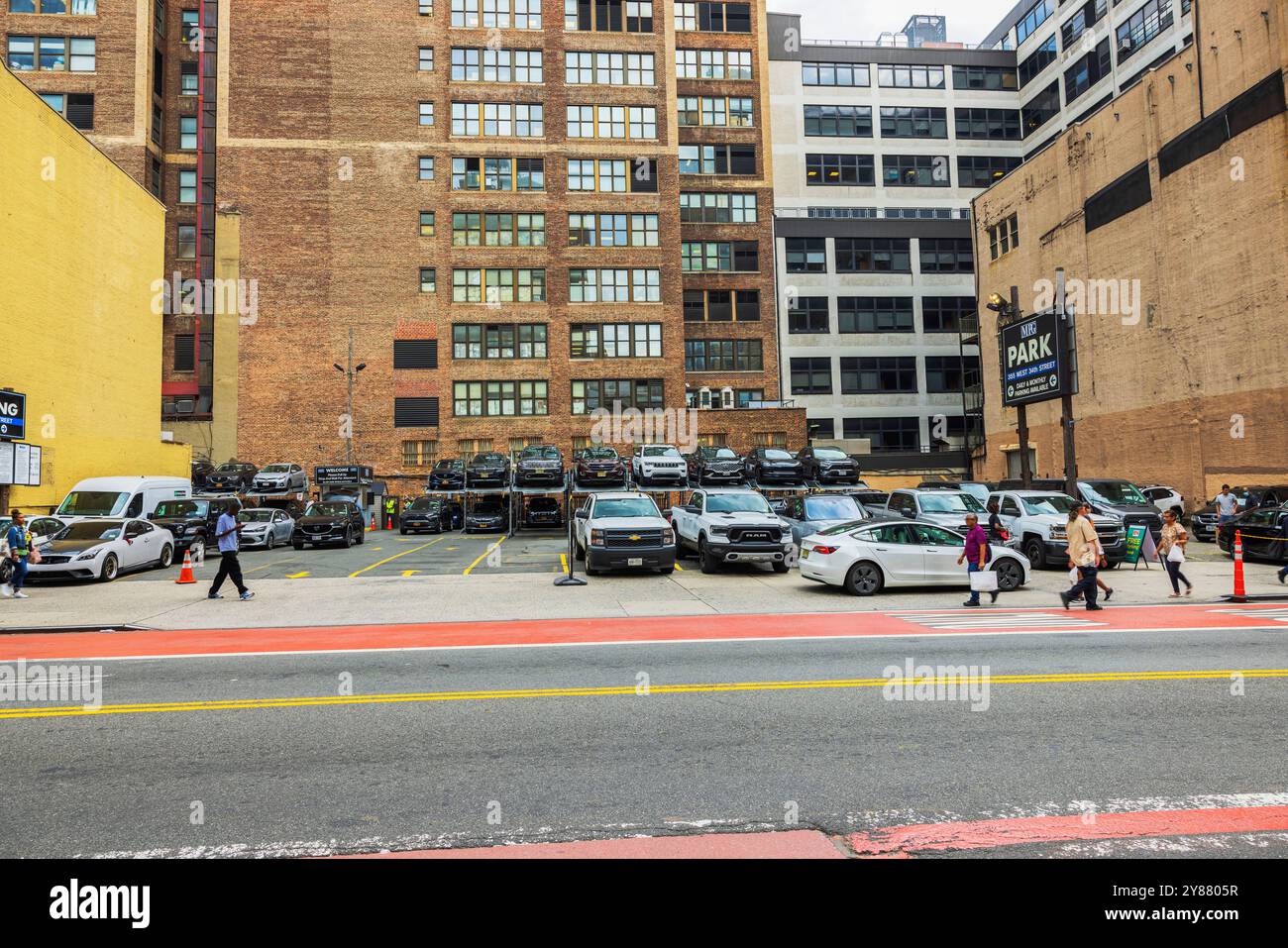 Outdoor parking lot on 34th Street in Manhattan city center with multi ...