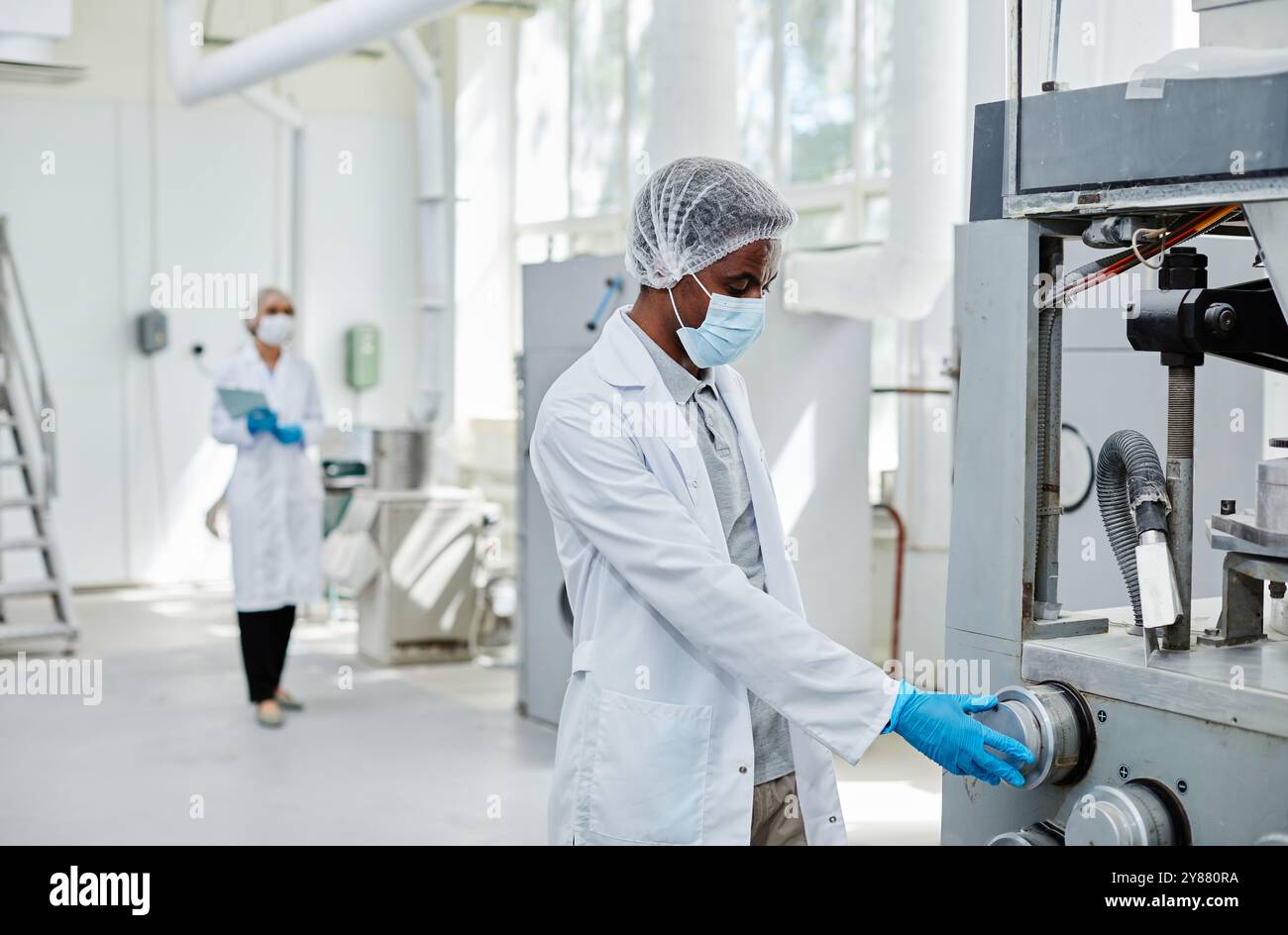 Side view of professional African American male production supervisor ...