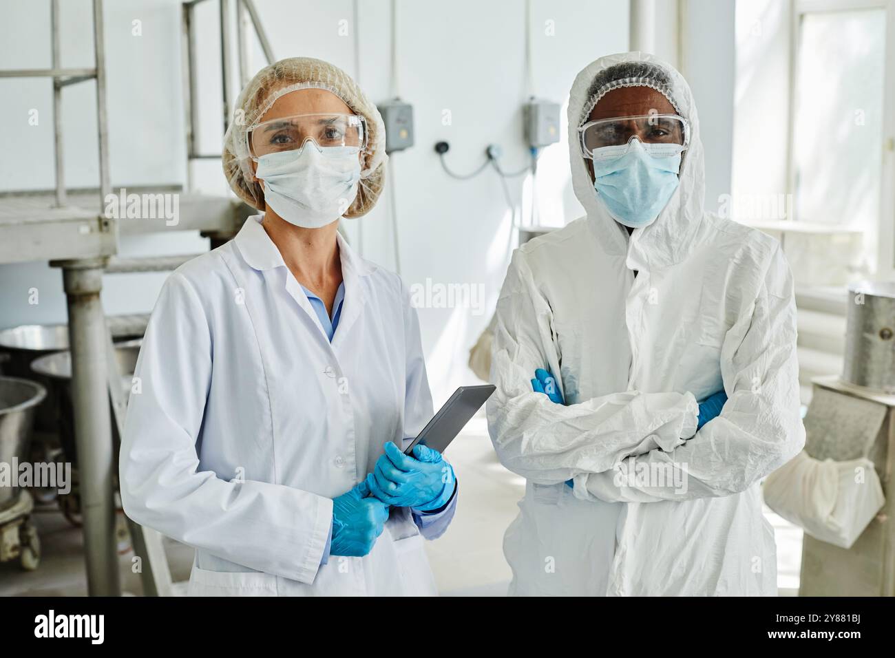 Medium portrait shot of female process technician with digital tablet ...