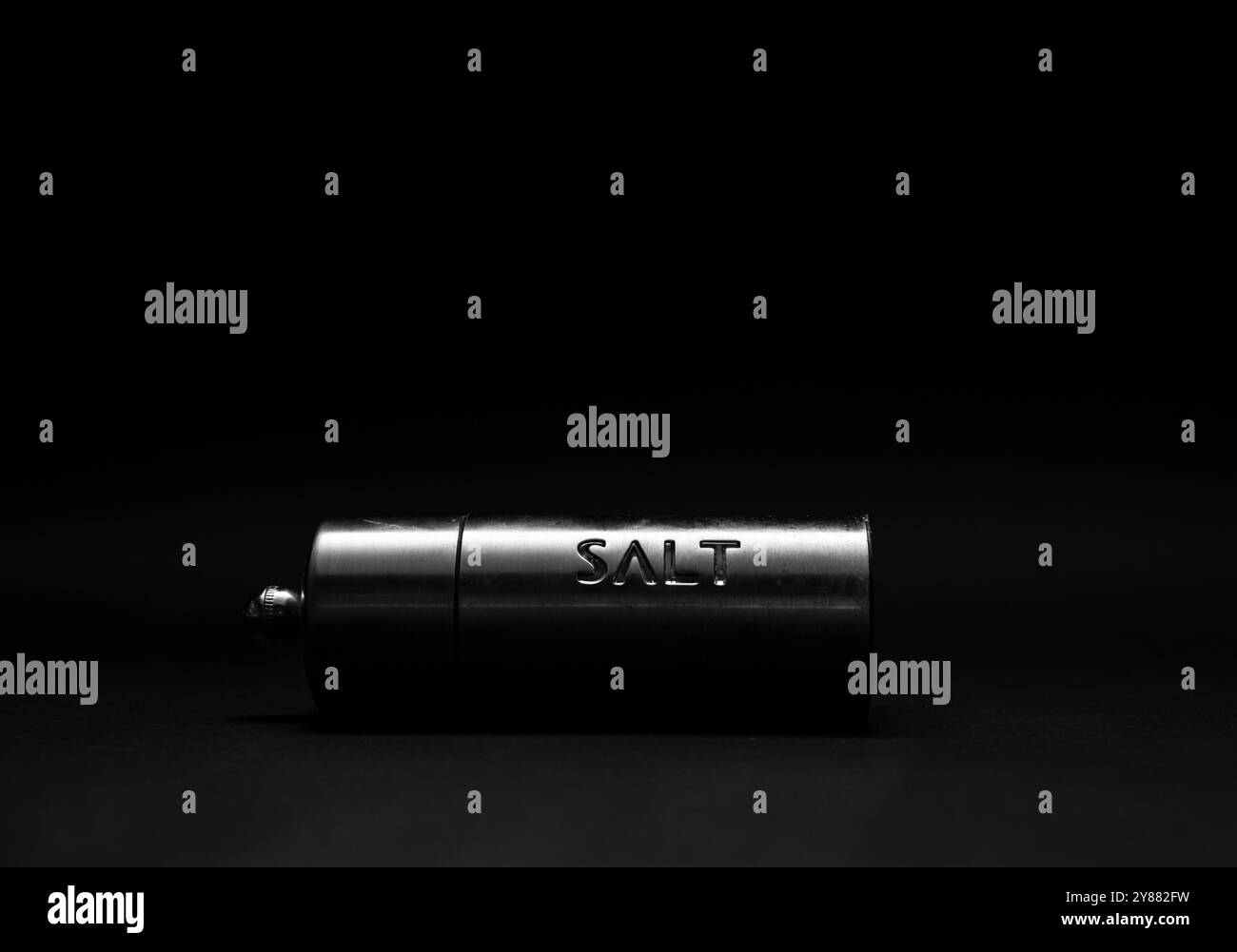 Stainless steel salt and pepper pots on a black background Stock Photo ...