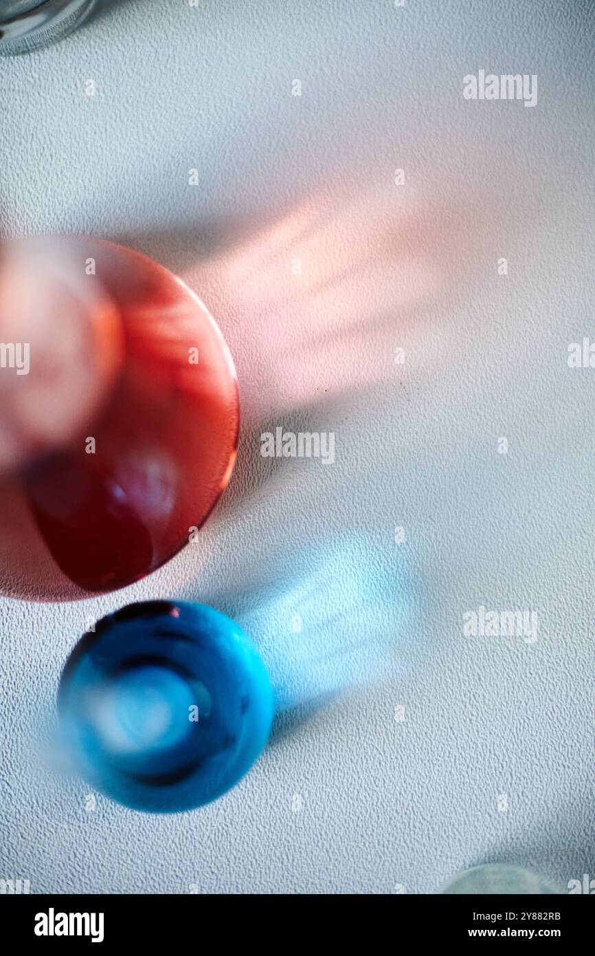Top view of light reflection going through glass beakers filled with ...