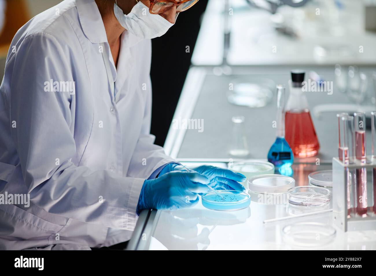 Female microbiologist in blue hi-res stock photography and images - Alamy