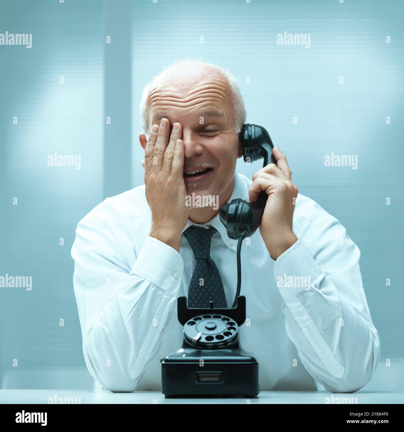 Older businessman is caught off guard by a conversation he's having on ...