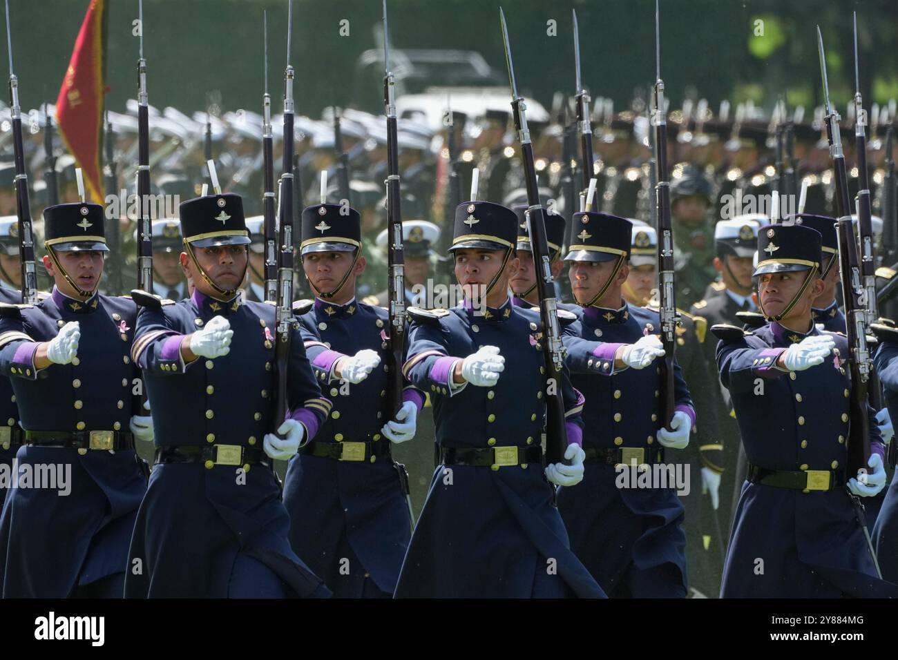Members of the military march during a review of the troops by Mexican ...
