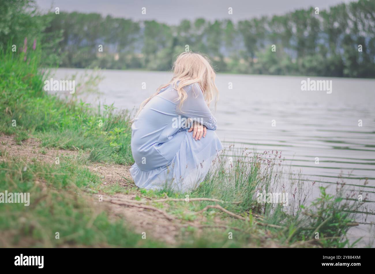 beautiful adorable divine girl in blue dress by the pond in the ...