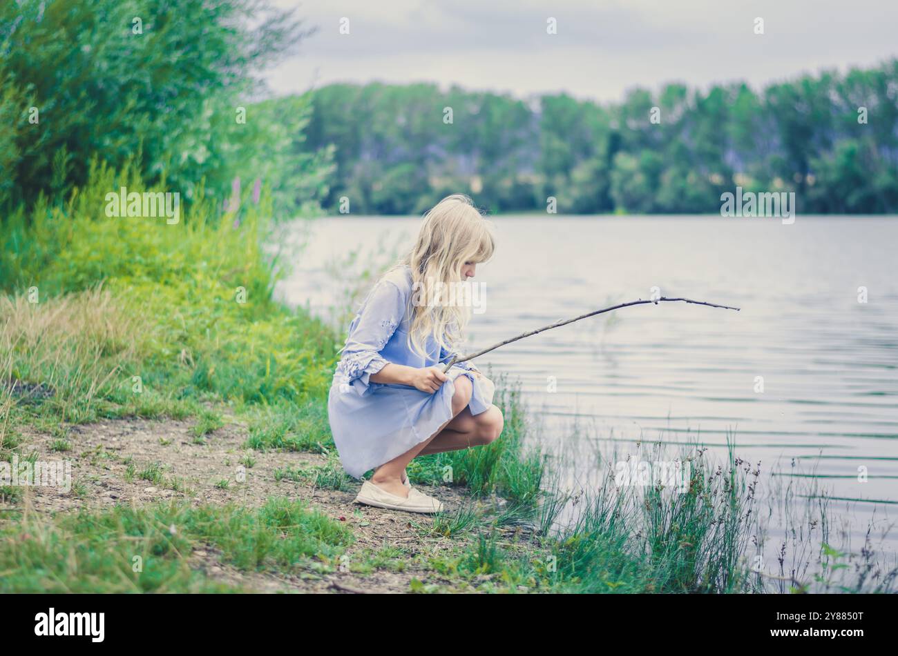 beautiful adorable divine girl in blue dress by the pond in the ...