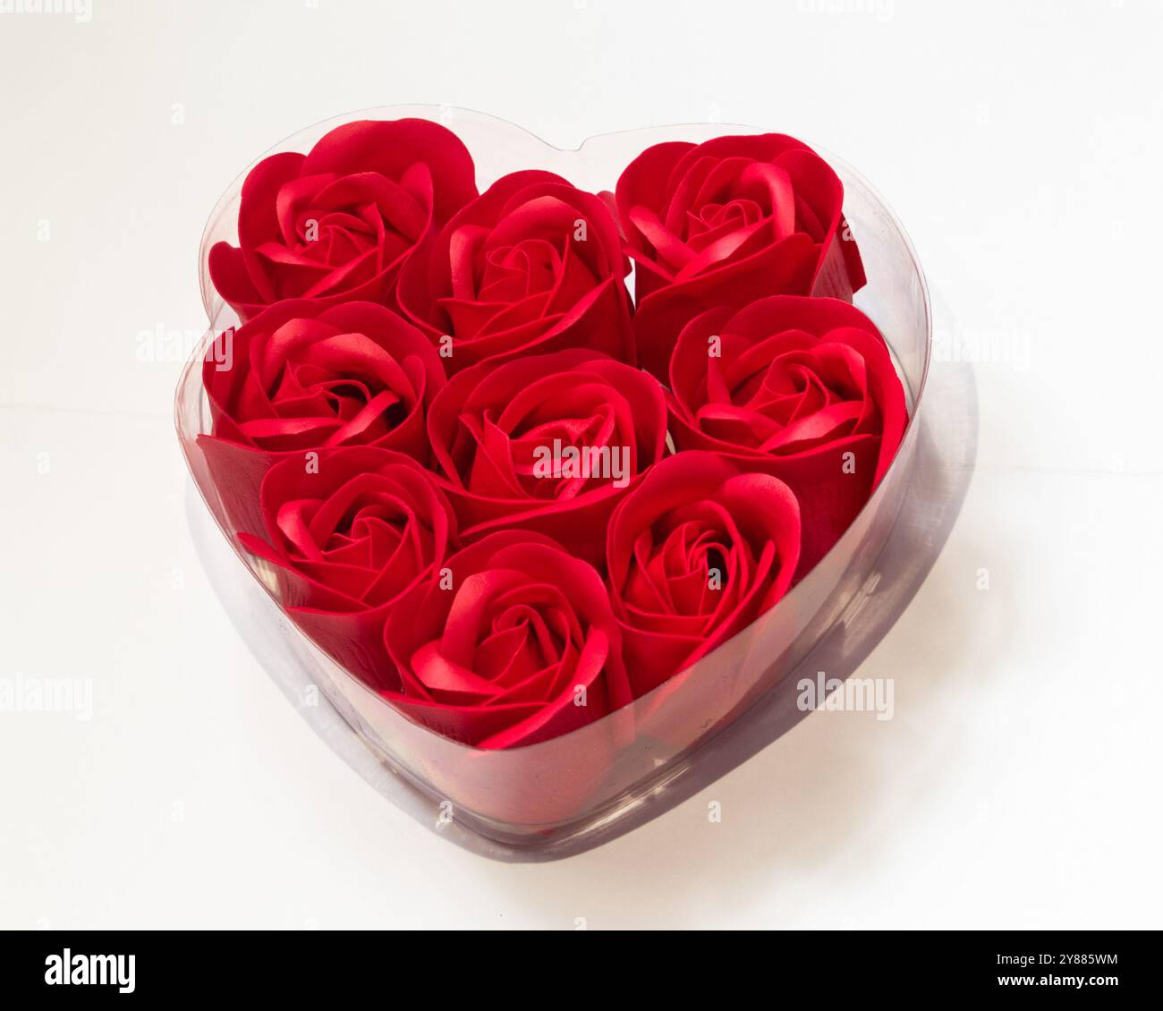 Clear heart shaped gift box with red roses Stock Photo - Alamy