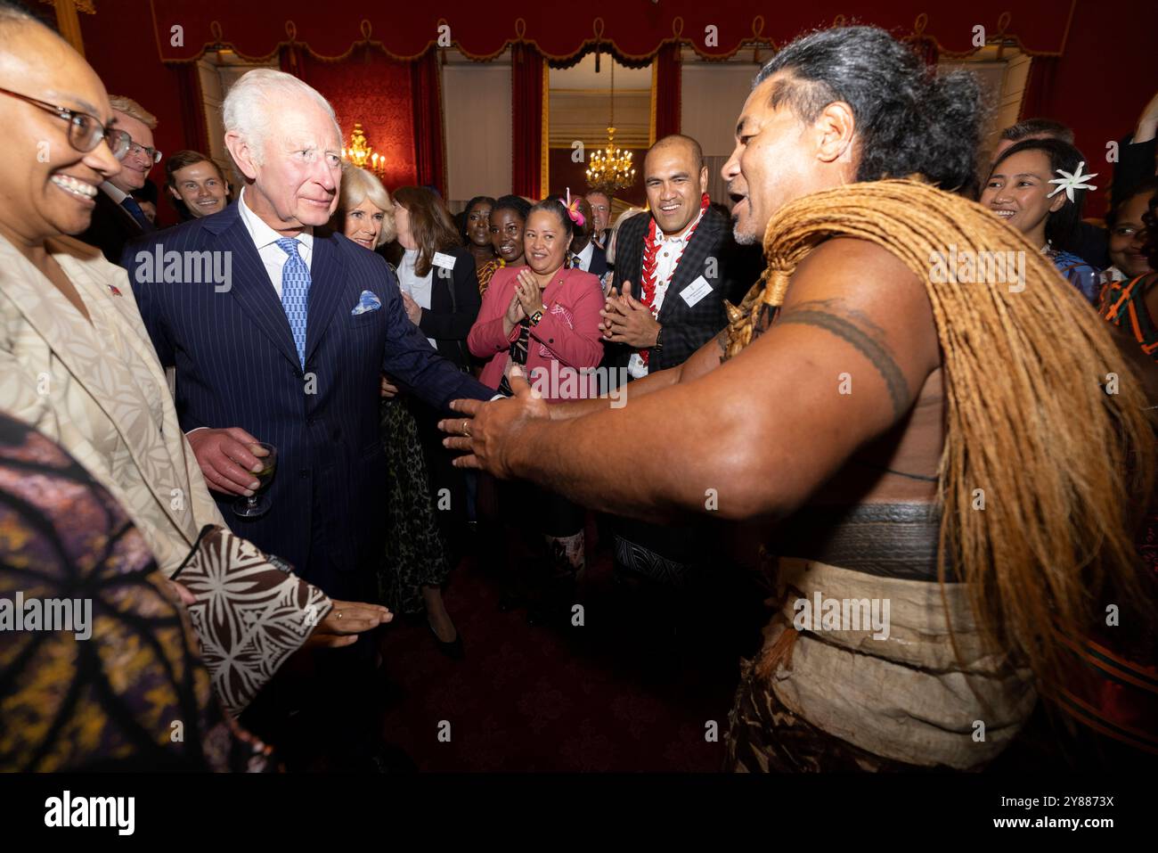 King Charles III reacts as former Samoan rugby player Freddie Tuilagi ...