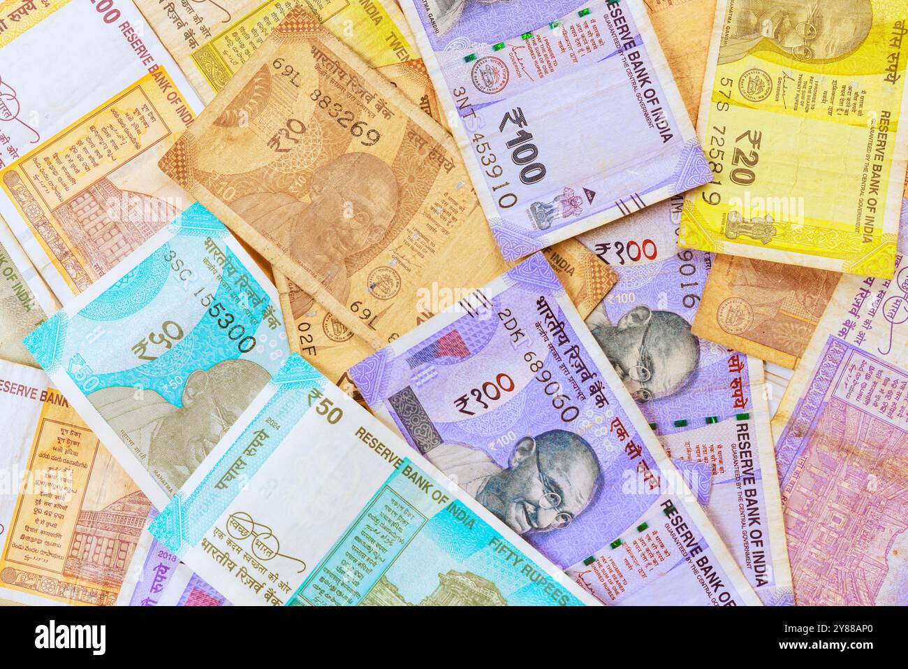 Cash with Indian rupees in various denominations of currency banknotes ...