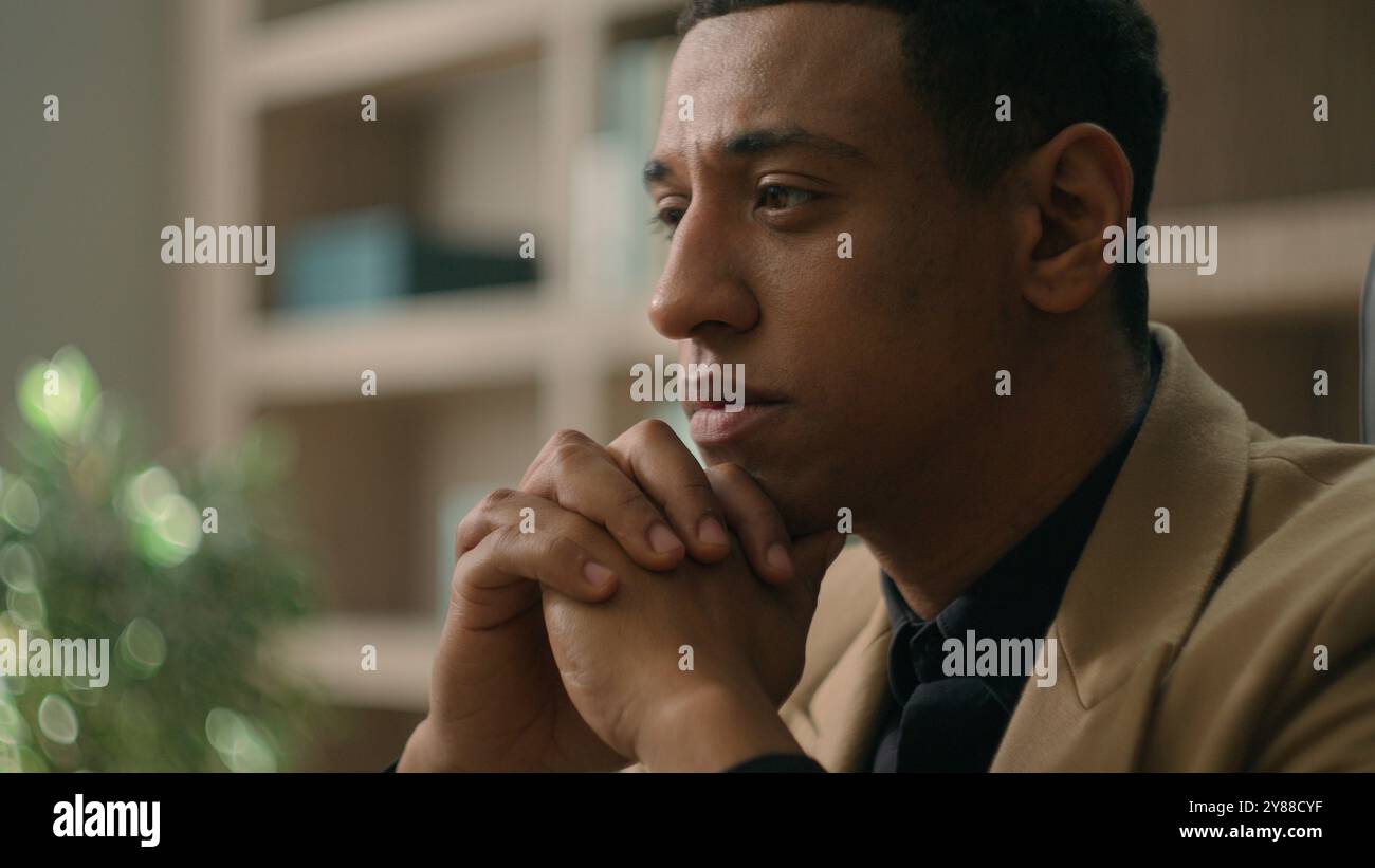 Close up face African American man ethnic thoughtful puzzled ...