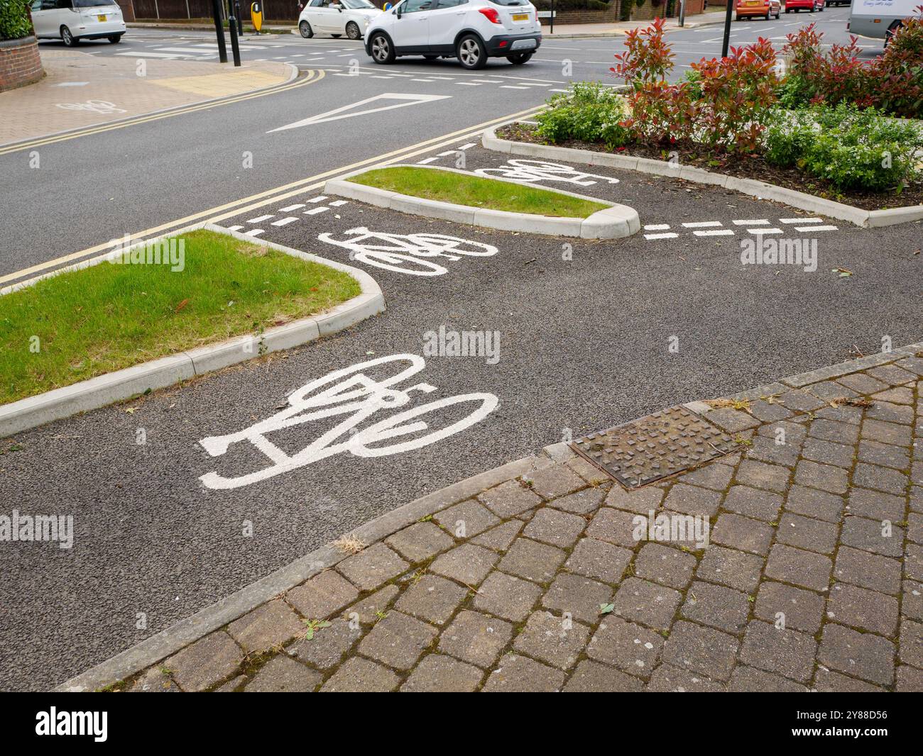 Dedicated bicycle lane to separate bikes from cars at a road junction ...