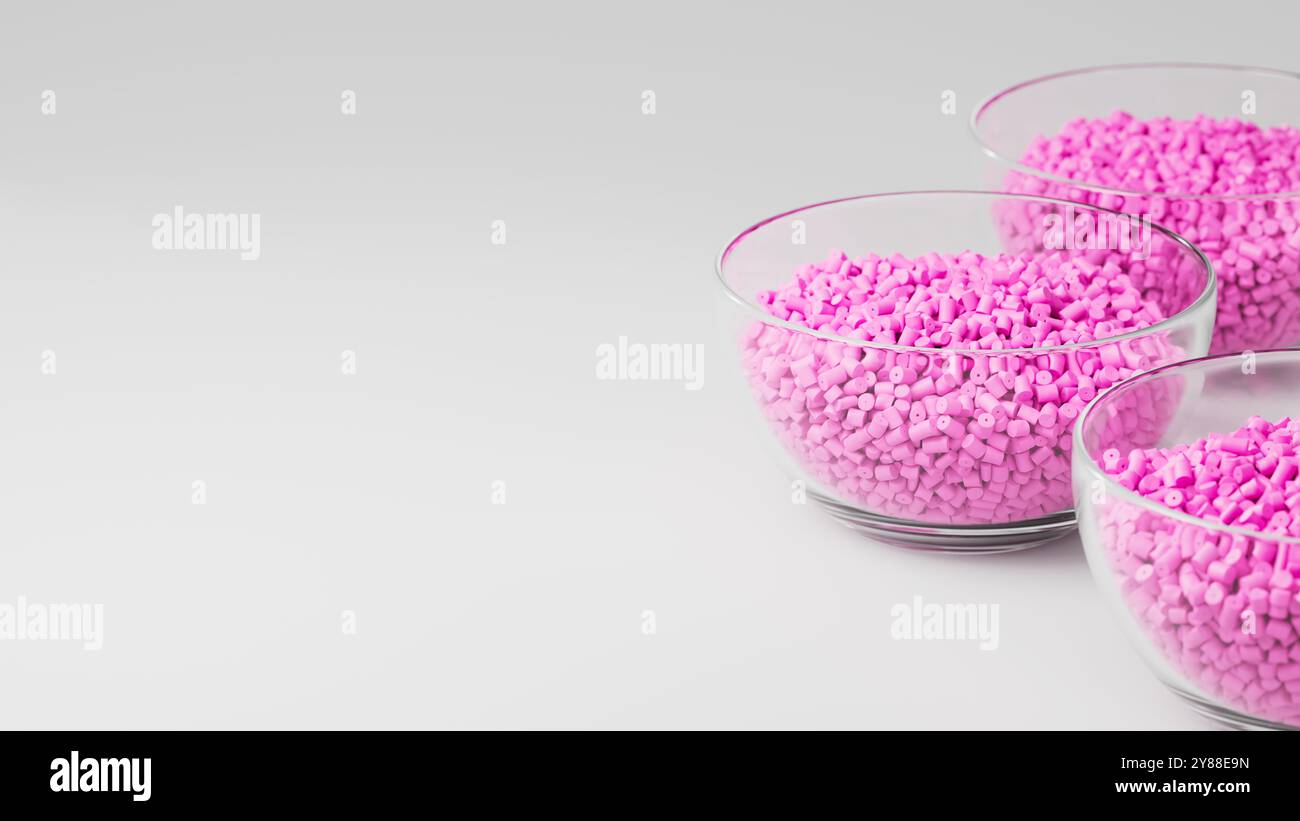 Glass cups with pink plastic polypropylene granules, masterbatch ...