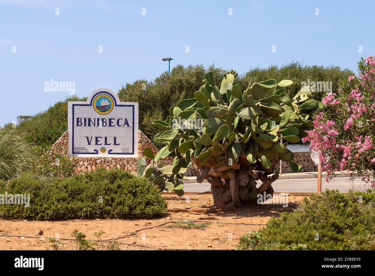 Large stone place name sign of the seaside resort of Binibeca Vells on ...