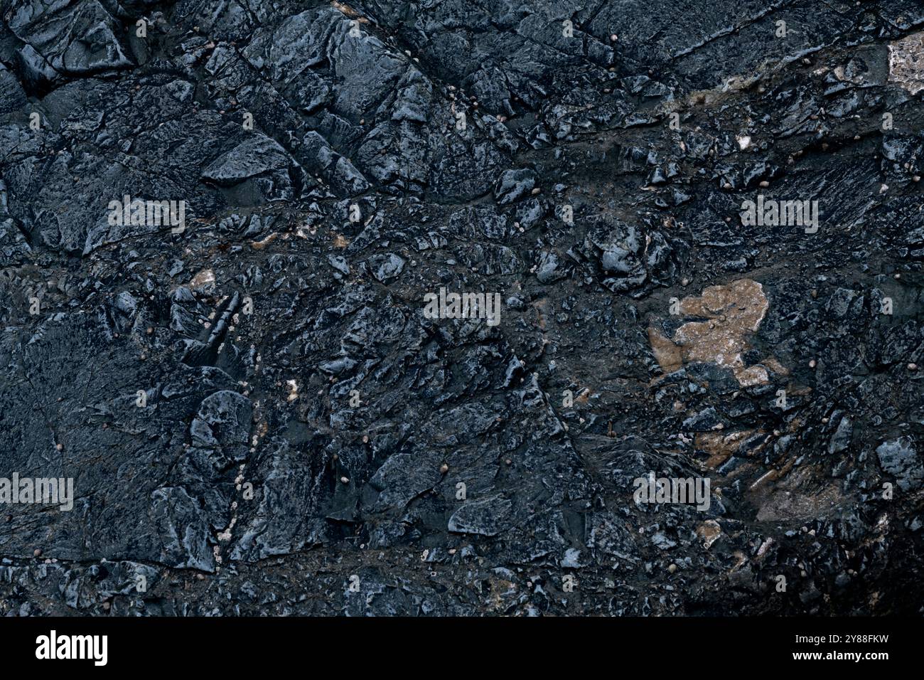 Dark Stone Texture with Jagged Patterns on Bunmahon Beach, Ireland ...