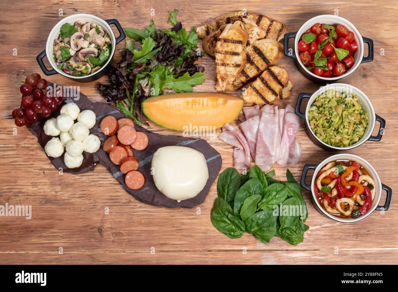 cold cuts , salads and fruit on display Stock Photo - Alamy