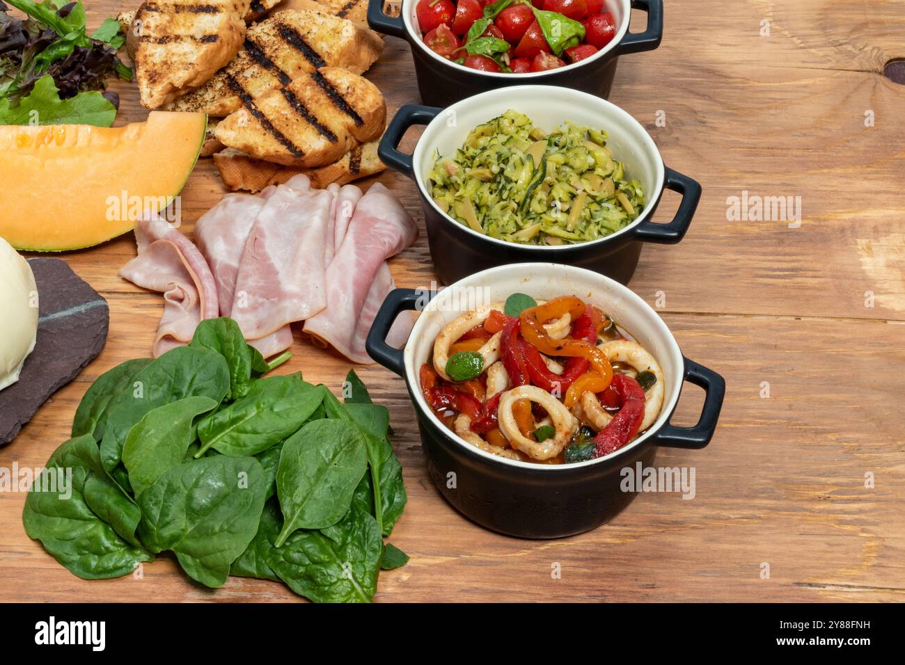 cold cuts , salads and fruit on display Stock Photo - Alamy