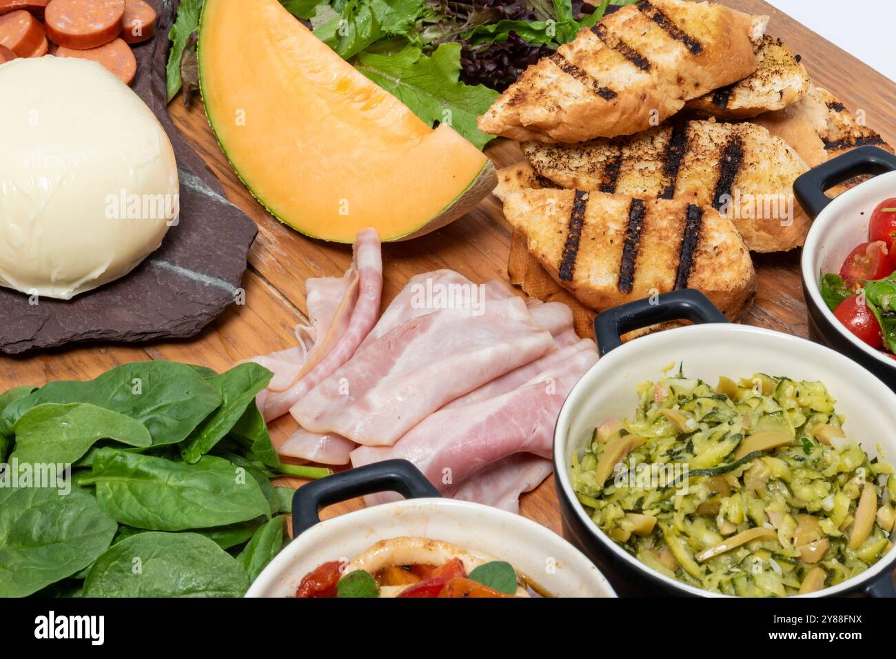cold cuts , salads and fruit on display Stock Photo - Alamy
