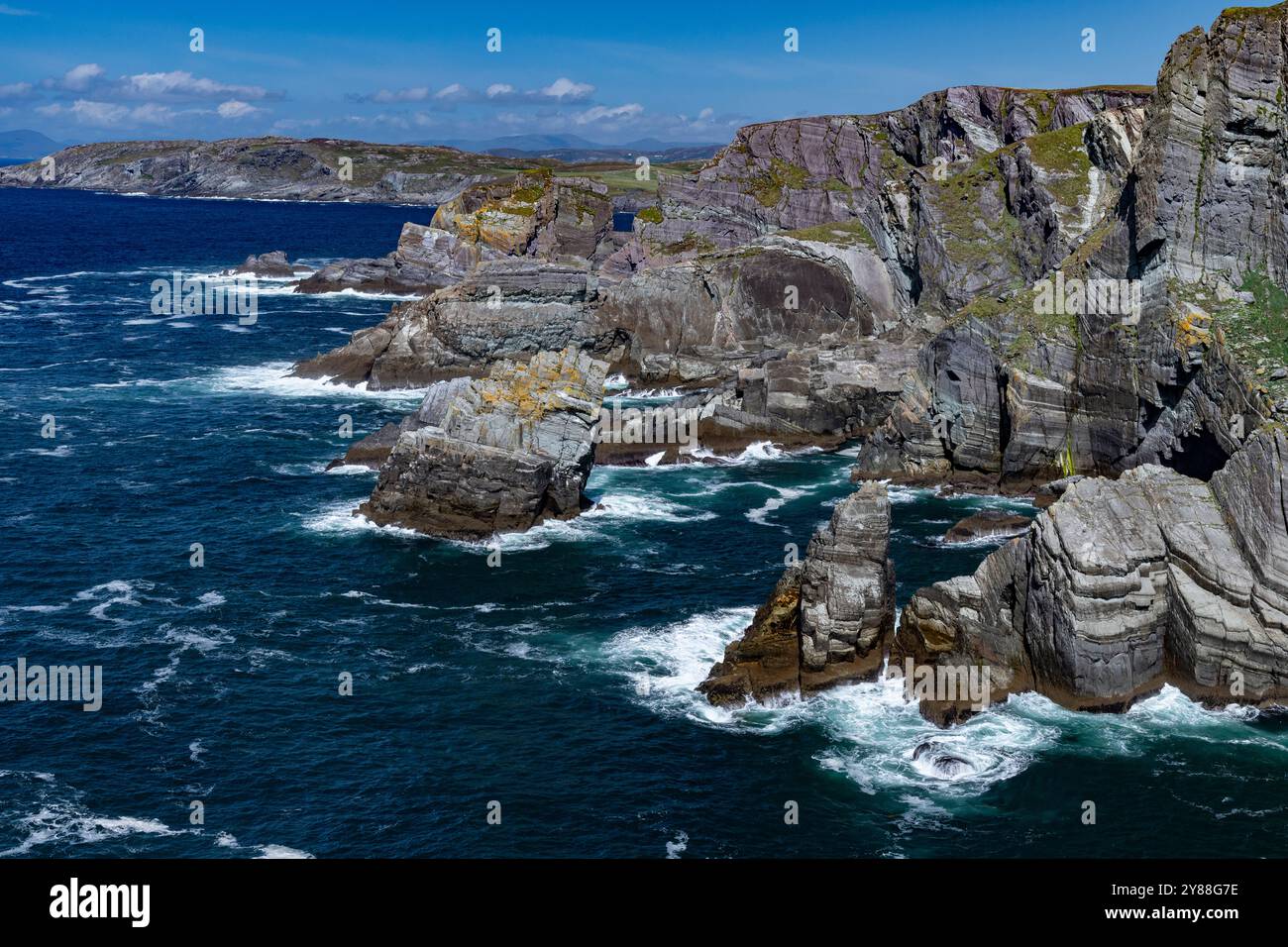 The complex rock formations at Mizen Head show the intricate patterns ...