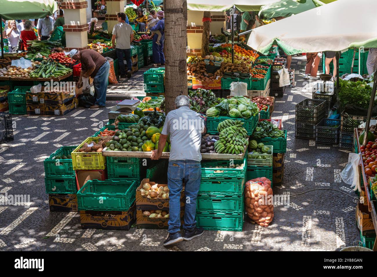 People buy fresh fruits and vegetables at the famous market - Mercado ...